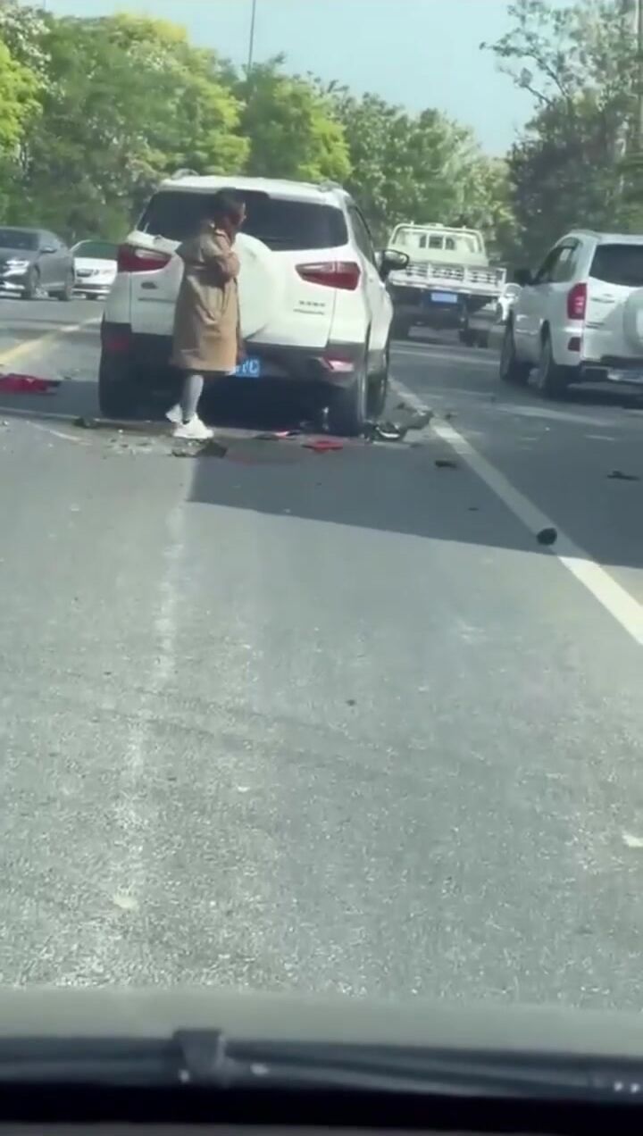 Biker Stuck Under Car Waving His Hand For Help
