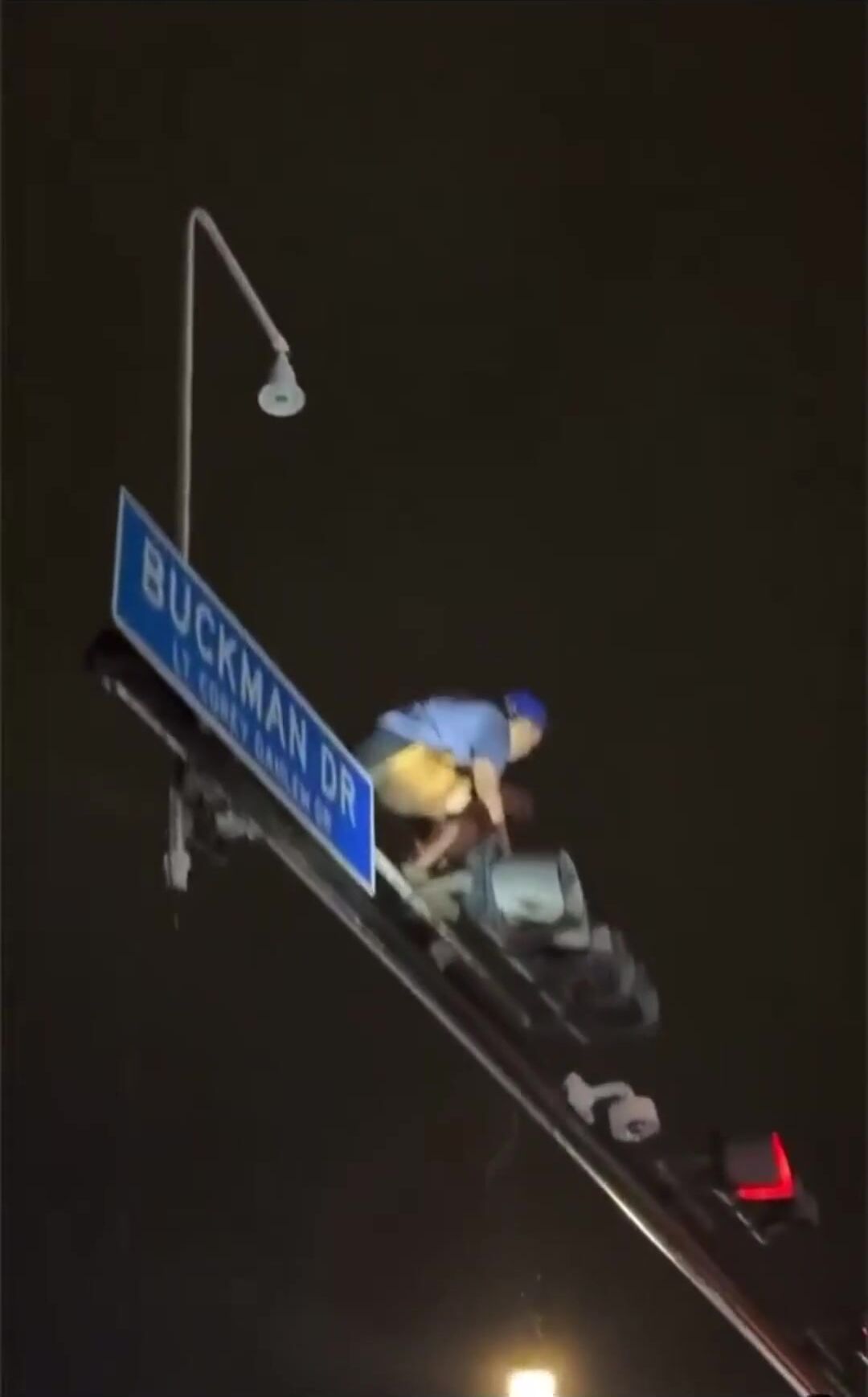 Idiot Falls After Climbing Traffic Lights To Celebrate His Team
