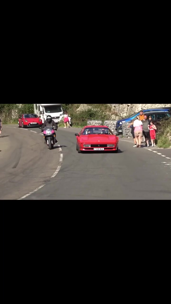 Biker Tries To Out Do A Ferrari Driver